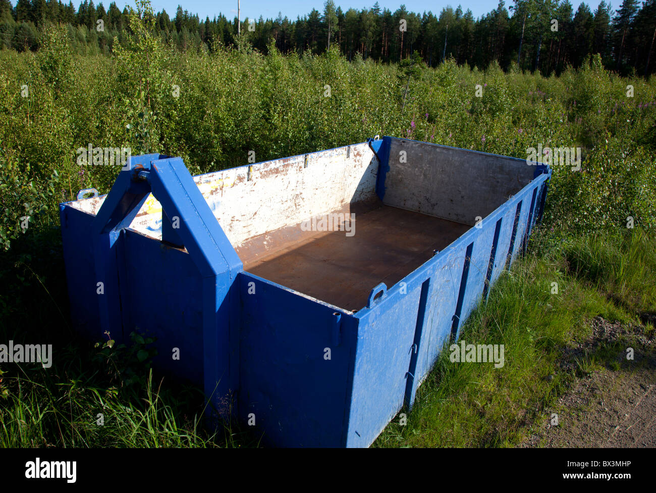 Empty blue skip at countryside , Finland Stock Photo - Alamy