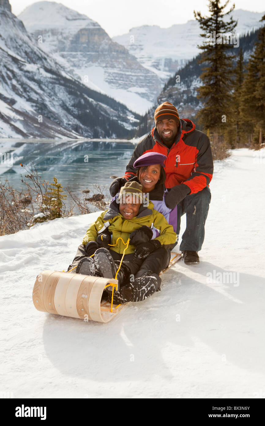 A Family Rides A Toboggan; Lake Louise, Alberta, Canada Stock Photo - Alamy