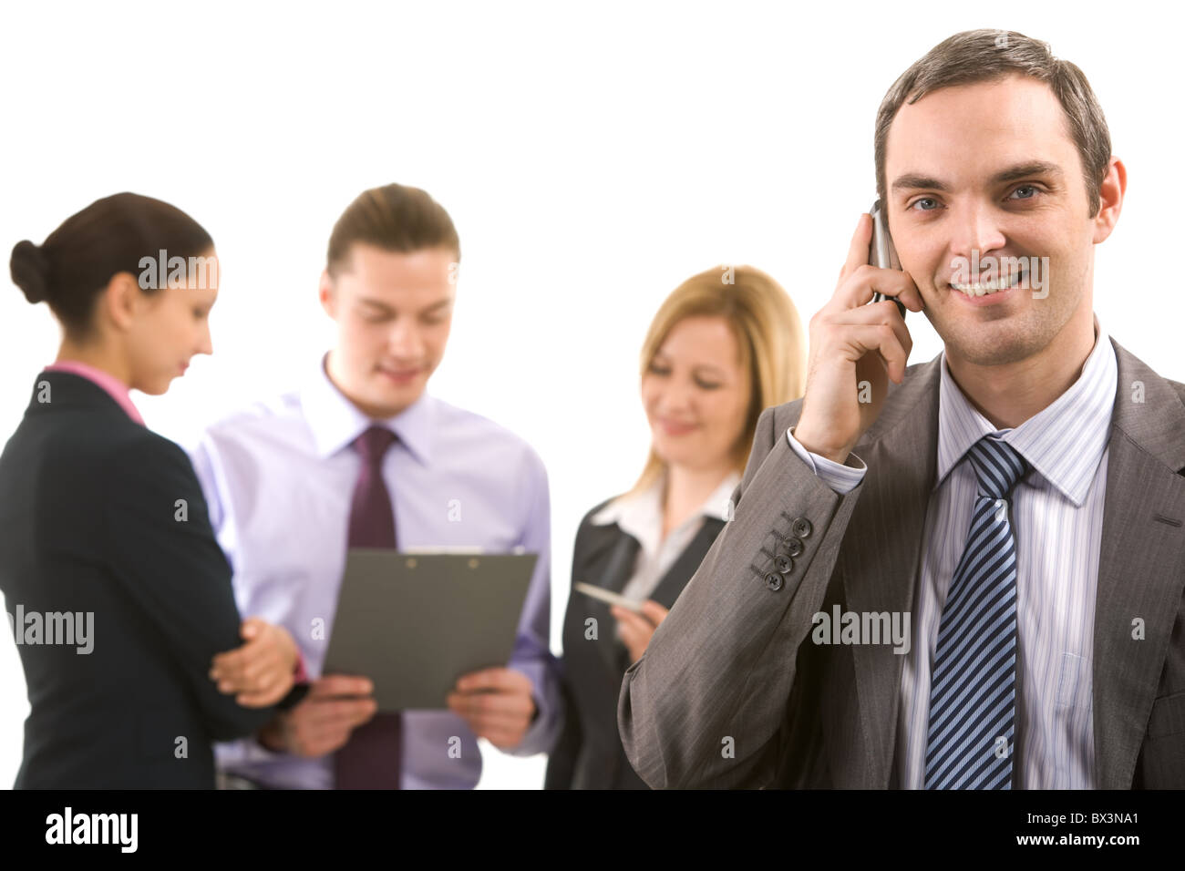 Photo of handsome employer calling his partner with working employees ...