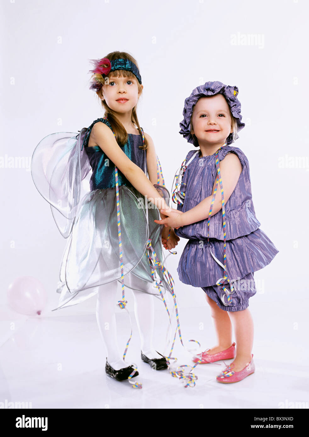 Two children in the disguises indoors Stock Photo - Alamy