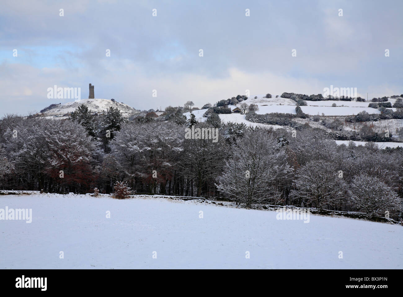 Deep snow in Honley fields and distant Jubilee Tower on Castle Hill ...