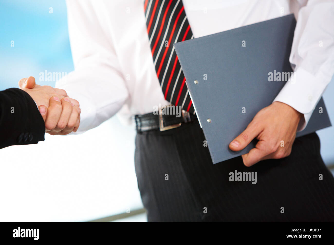 Image of partners handshake after signing contract Stock Photo - Alamy