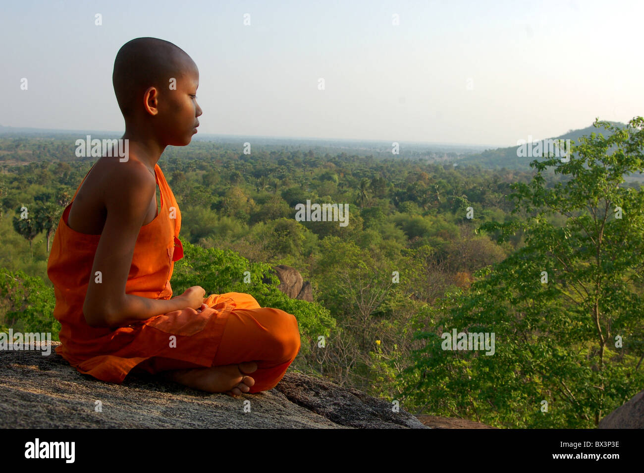 young monk meditating Stock Photo - Alamy