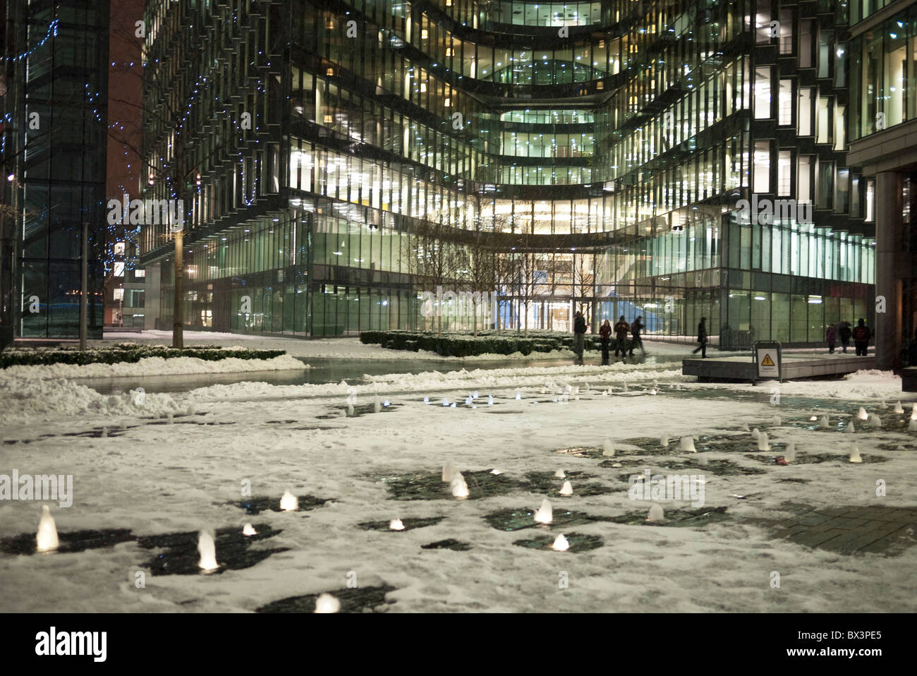 Night scene at More London on a cold winter evening. Fountains and ...