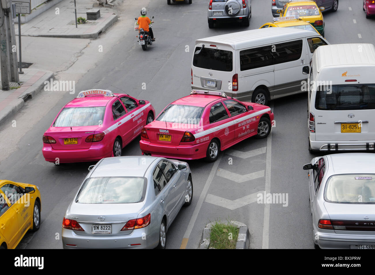 Two Taxi try to come on the Road in a Traffic jam Stock Photo - Alamy