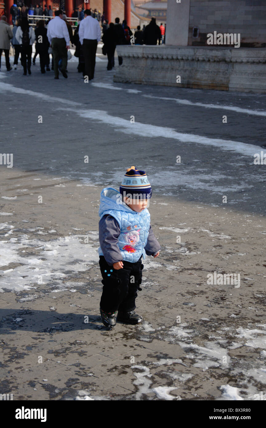 Cute little winter dressed boy at the Forbidden City in Beijing, China ...