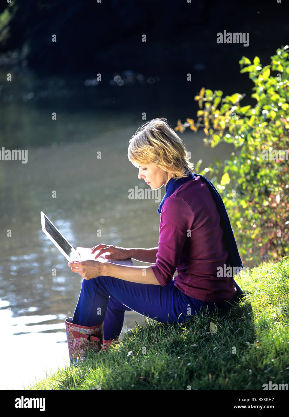 Woman in the park Stock Photo - Alamy