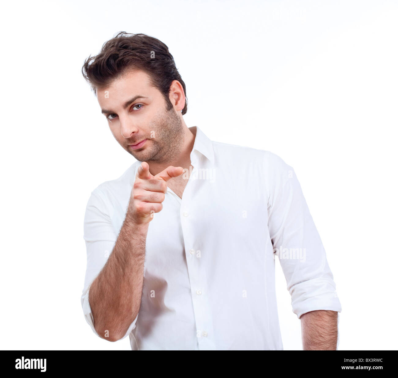 man in white shirt standing, pointing toward camera - isolated on white ...