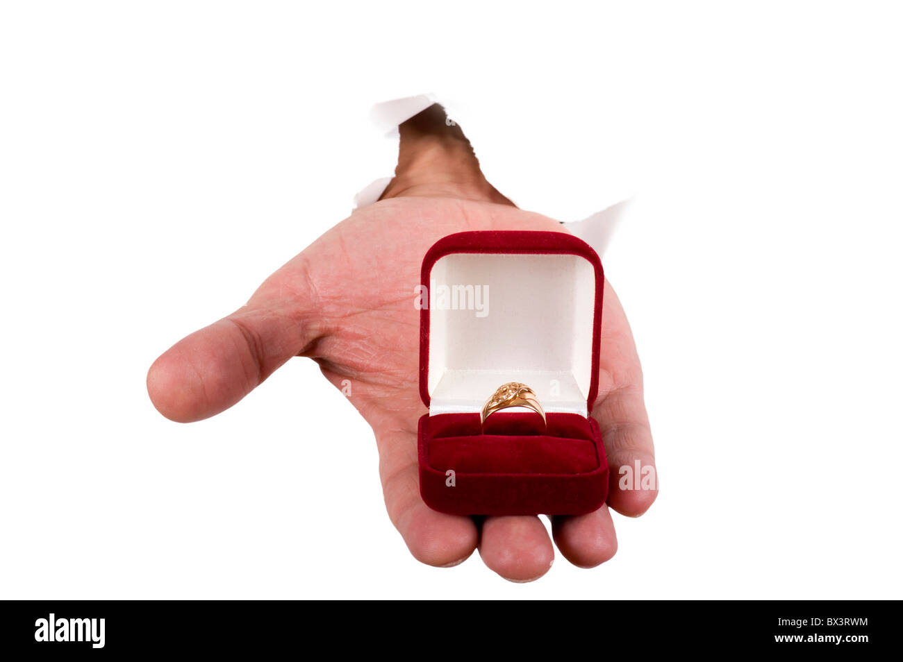 object on white - gold ring on the hand Stock Photo - Alamy