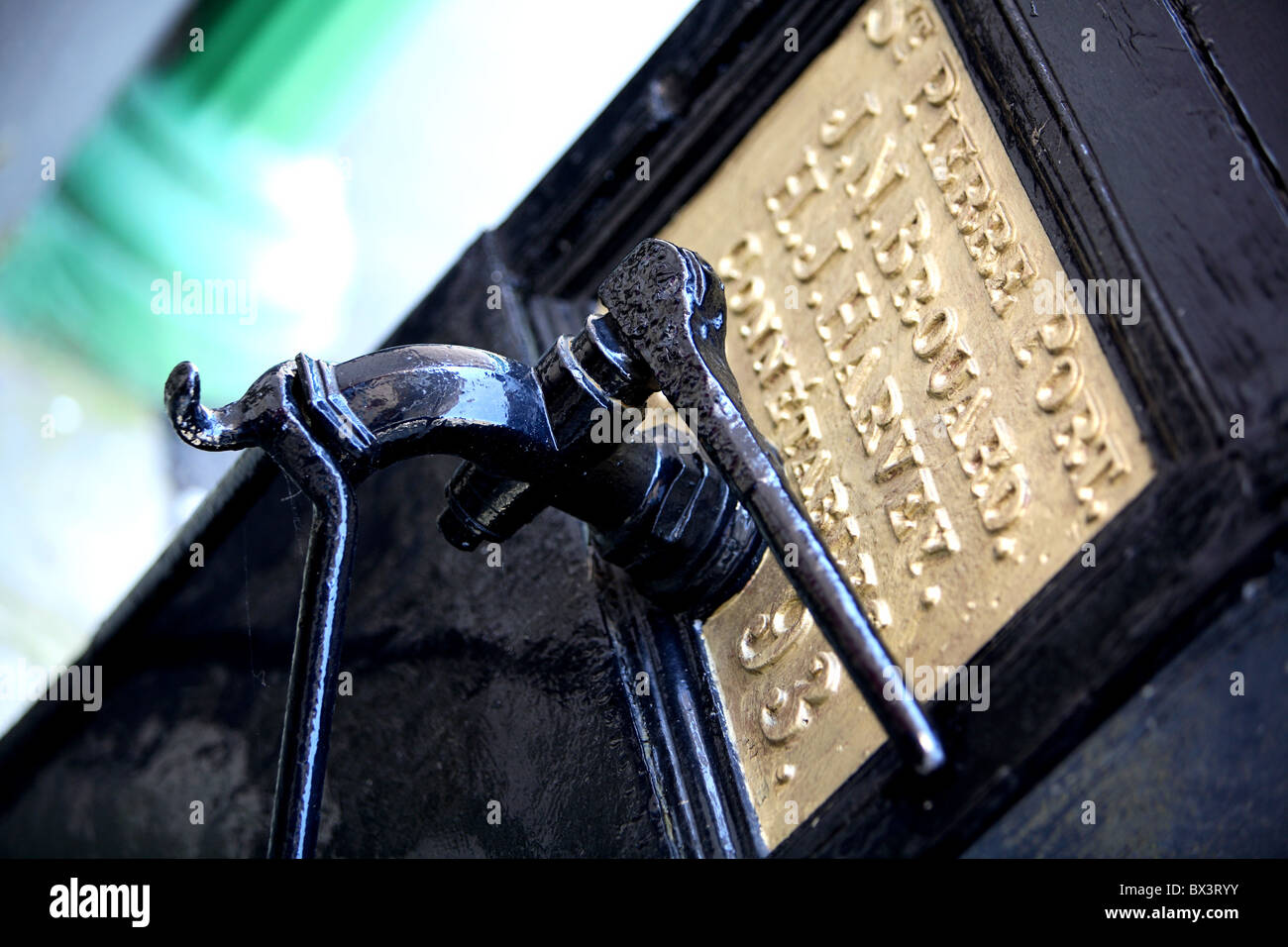 Old public water supply standpipe taps on the old streets of Guernsey ...