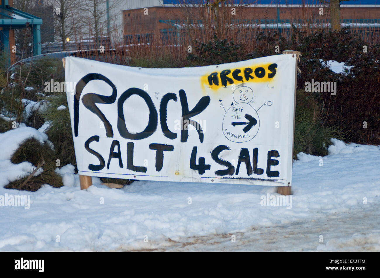 Rock salt for sale banner in a uk winter Stock Photo - Alamy