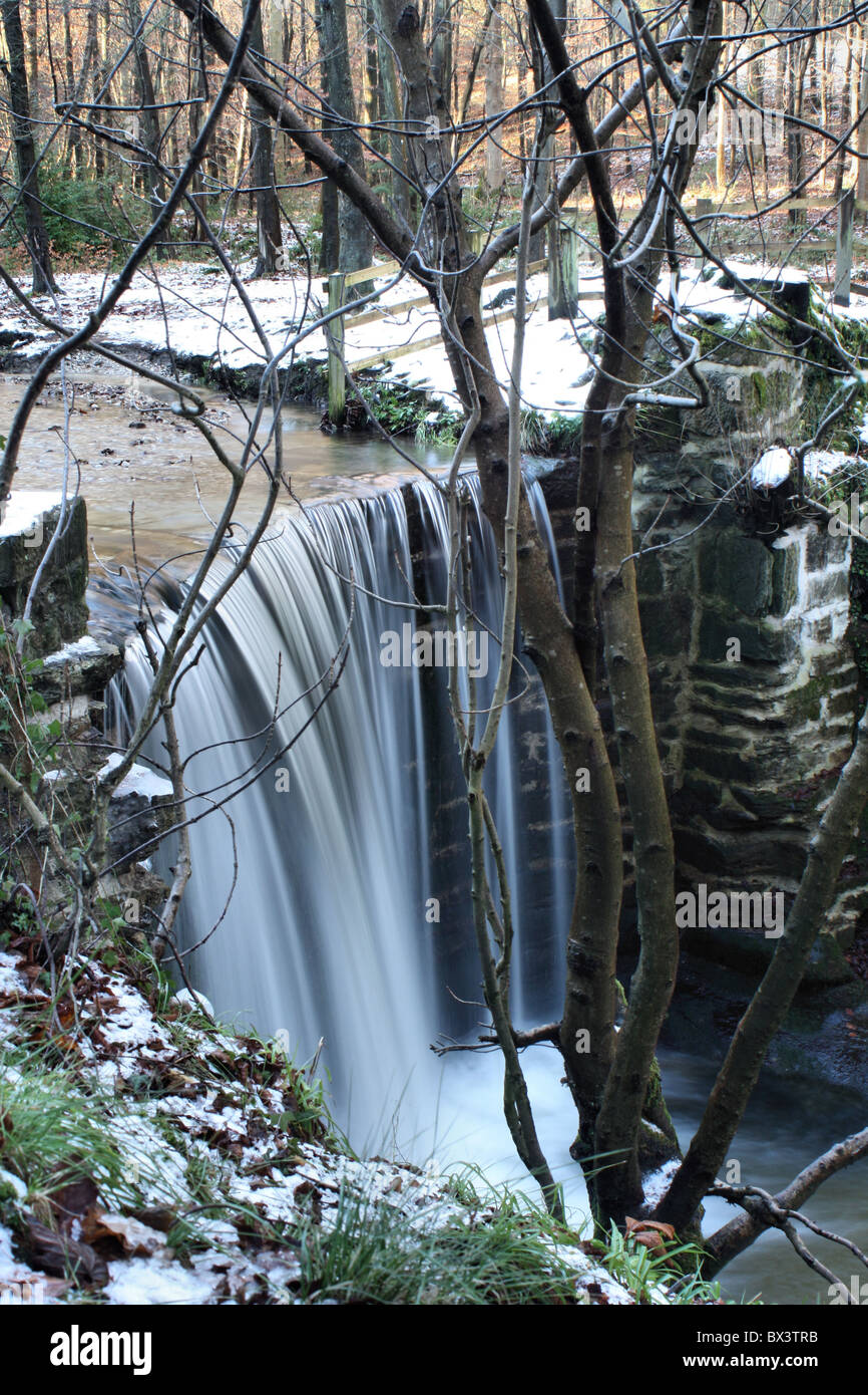 Bersham waterfall and River Clywedog with snow and autumn leaves near ...