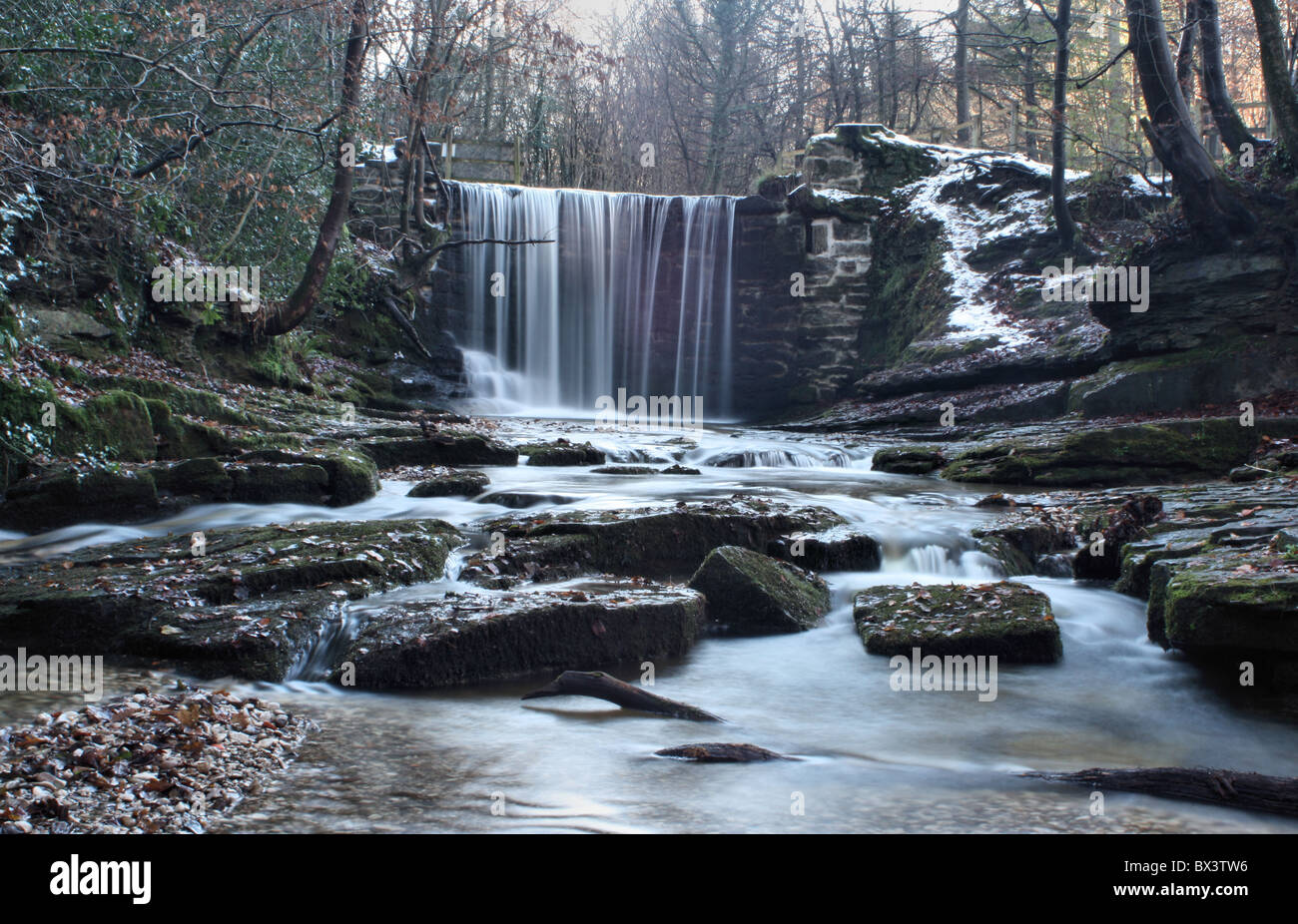 Bersham waterfall and River Clywedog with snow and autumn leaves near ...