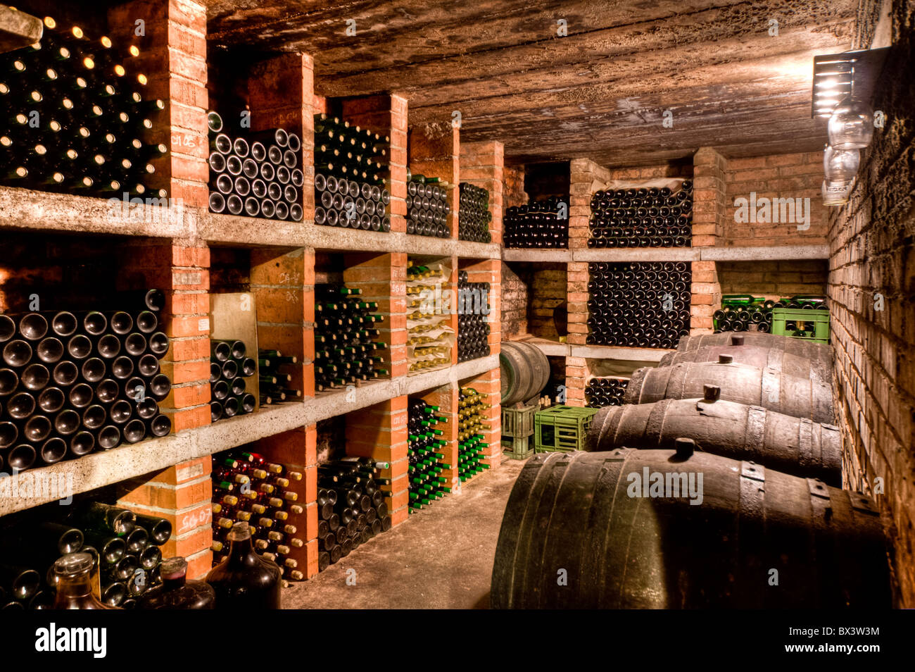 stacked up wine bottles in the cellar Stock Photo - Alamy