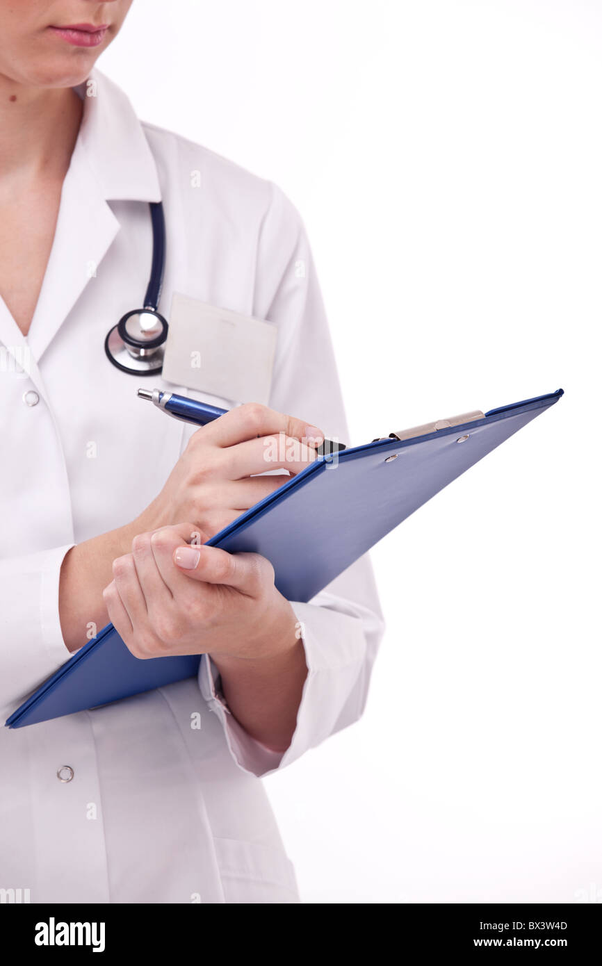 Doctor completing on medical card. Isolated on a white Stock Photo - Alamy