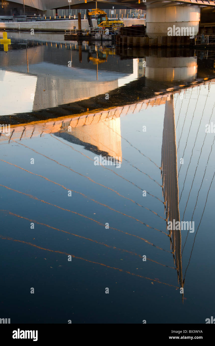 Imperial War Museum North and swing footbridge reflected in the ...