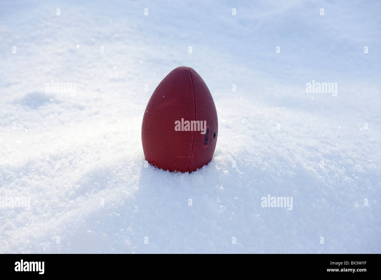 Football in the Snow Stock Photo - Alamy