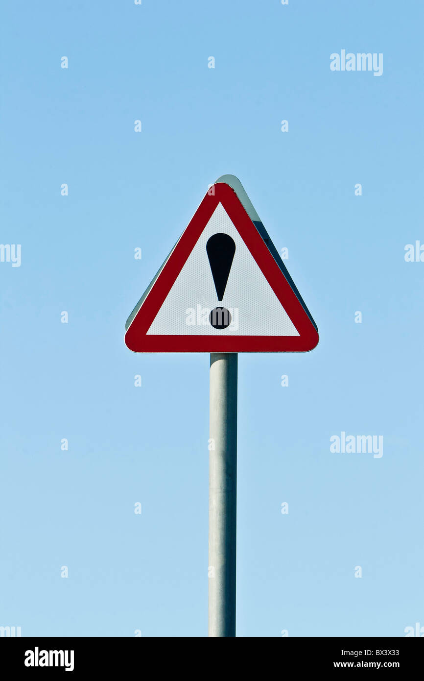 Hazard Road Sign against a blue sky Stock Photo - Alamy