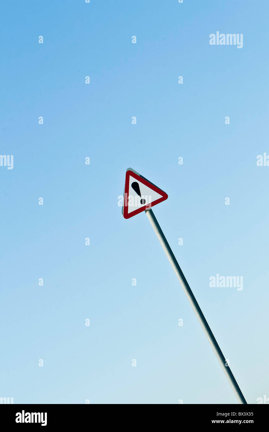 Hazard Road Sign against a blue sky Stock Photo - Alamy