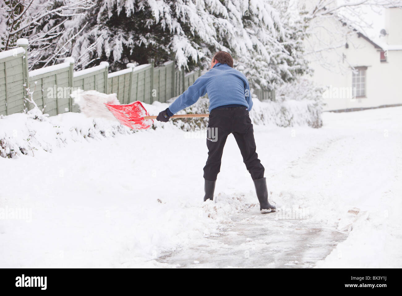 Shovelling snow road hi-res stock photography and images - Alamy