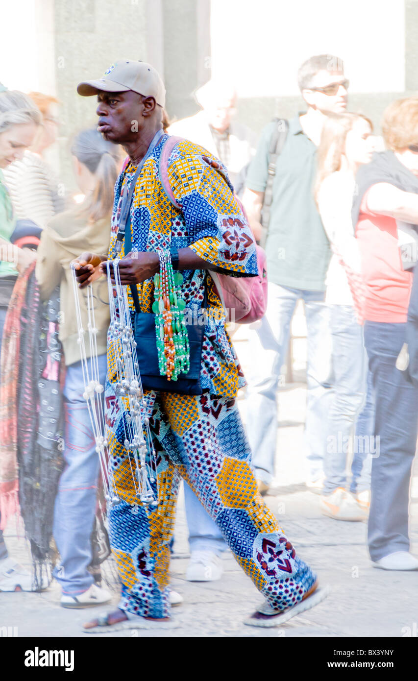 Colorfully dressed street peddler in Florence, Italy Stock Photo - Alamy