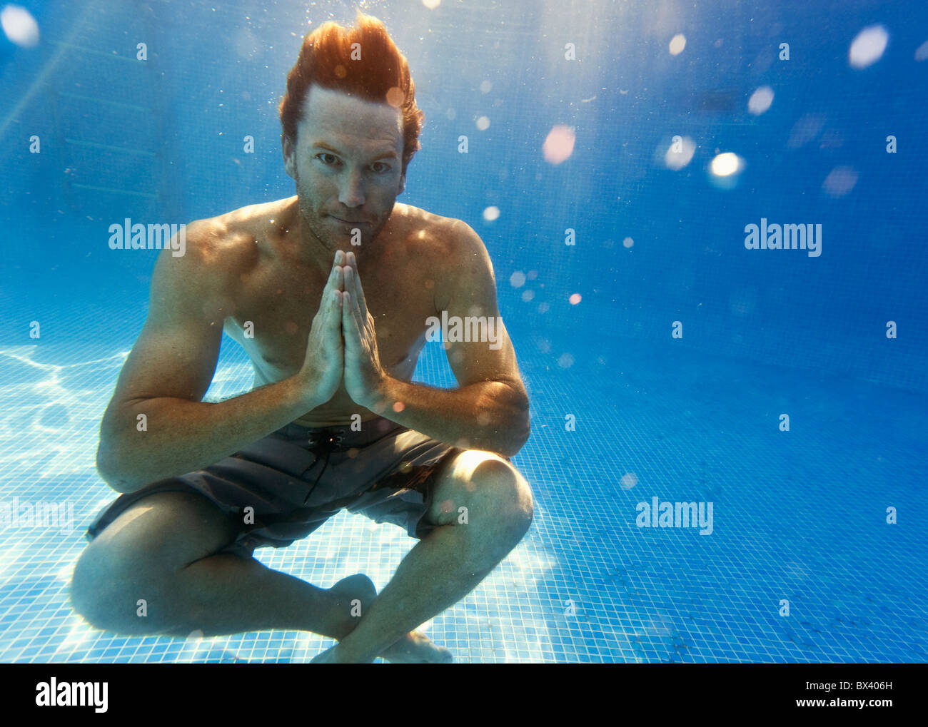 A Man Sitting Underwater In A Meditation Pose Stock Photo - Alamy