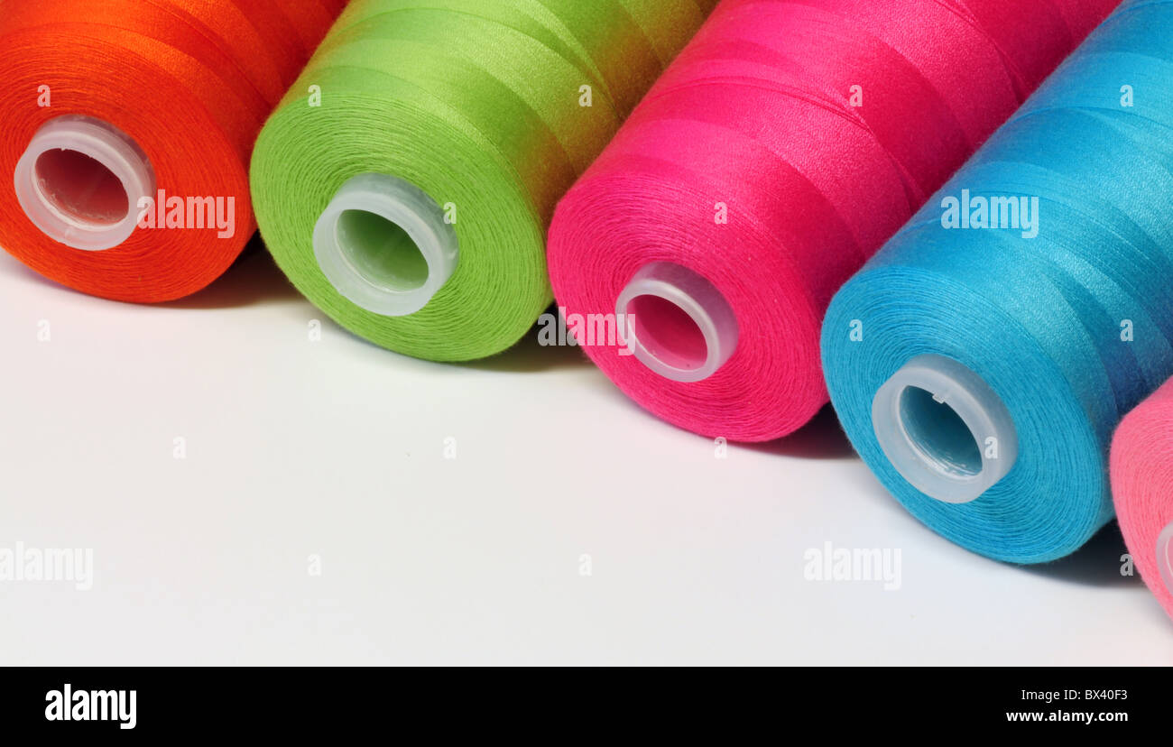 Group of multicolored sewing threads Stock Photo - Alamy
