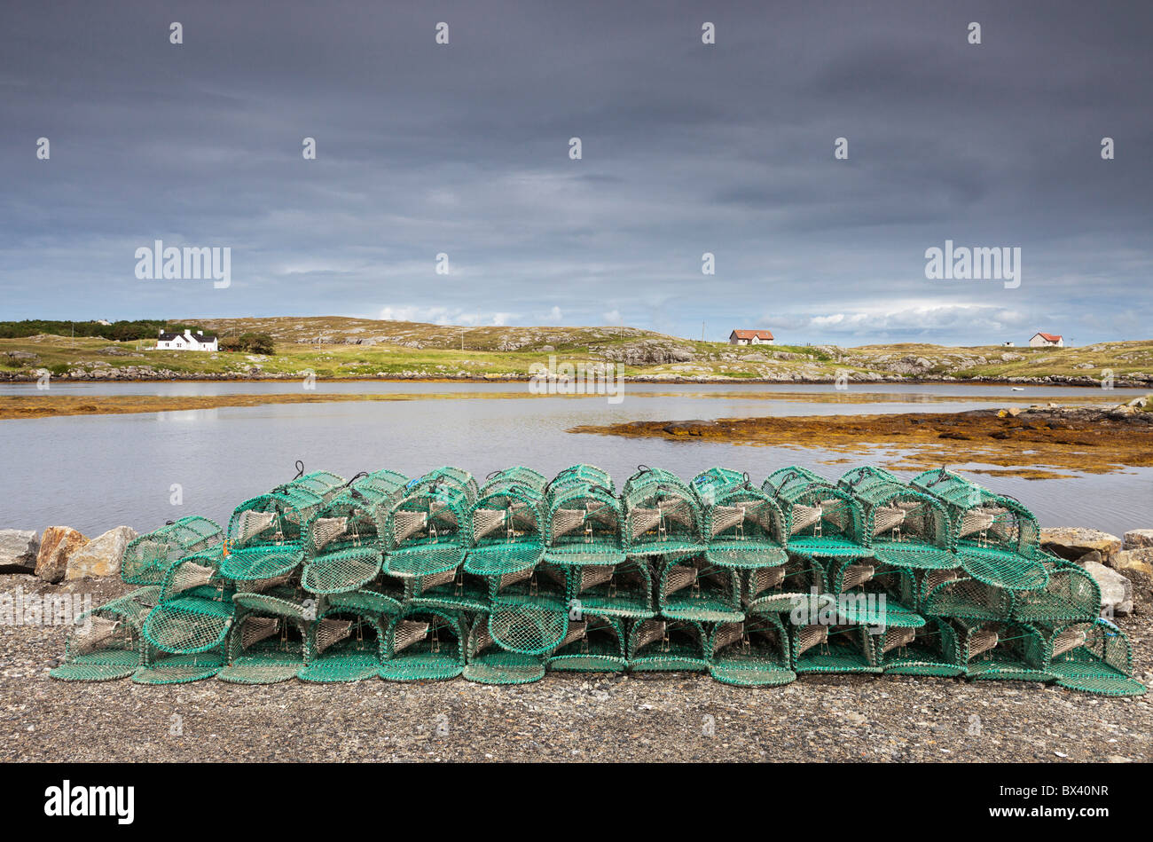 Fishing Traps Sitting On The Shore; Isle Of Barra, Scotland Stock Photo ...