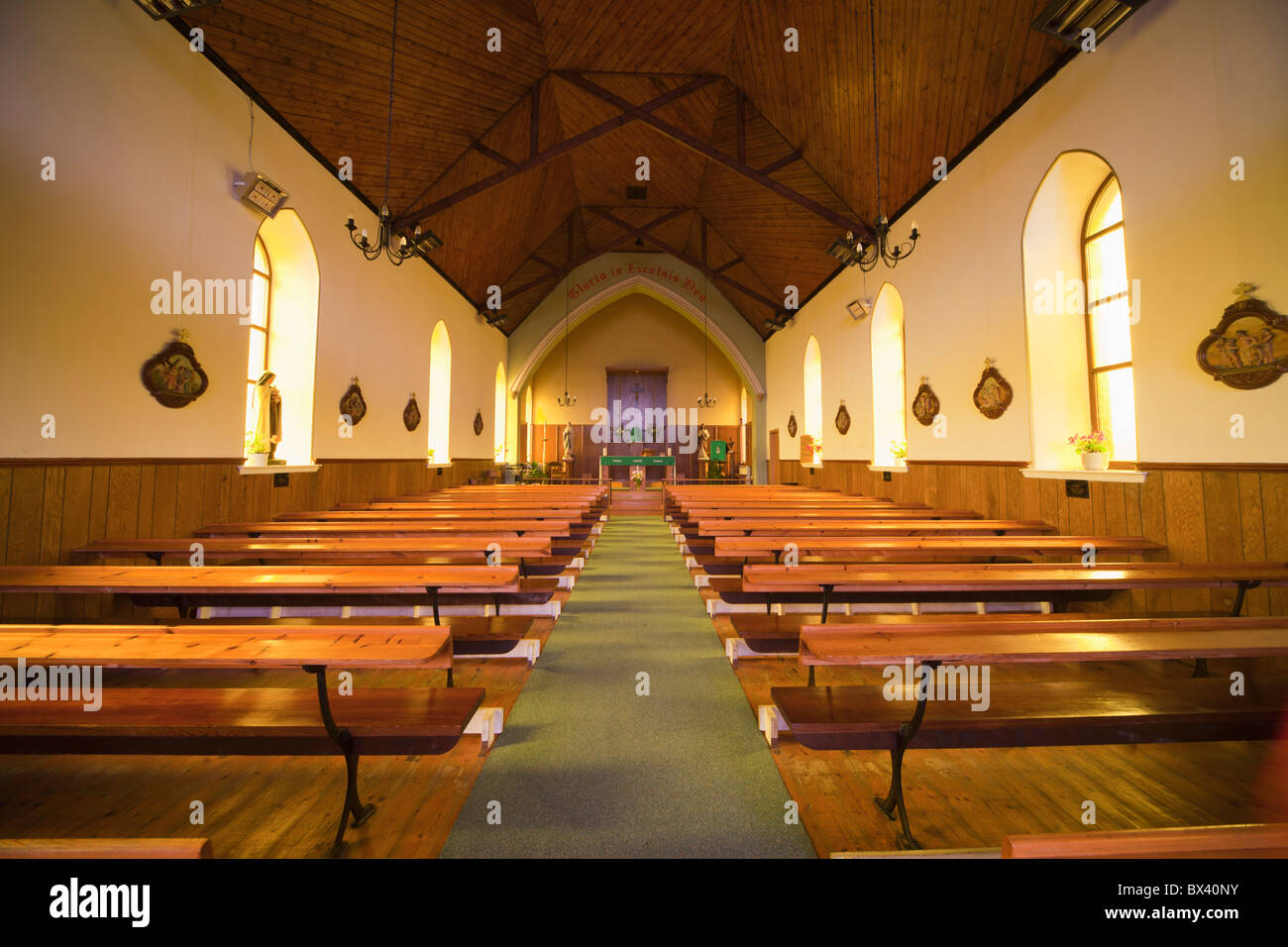 A Middle Aisle Of A Church With Wooden Benches On Either Side; St ...