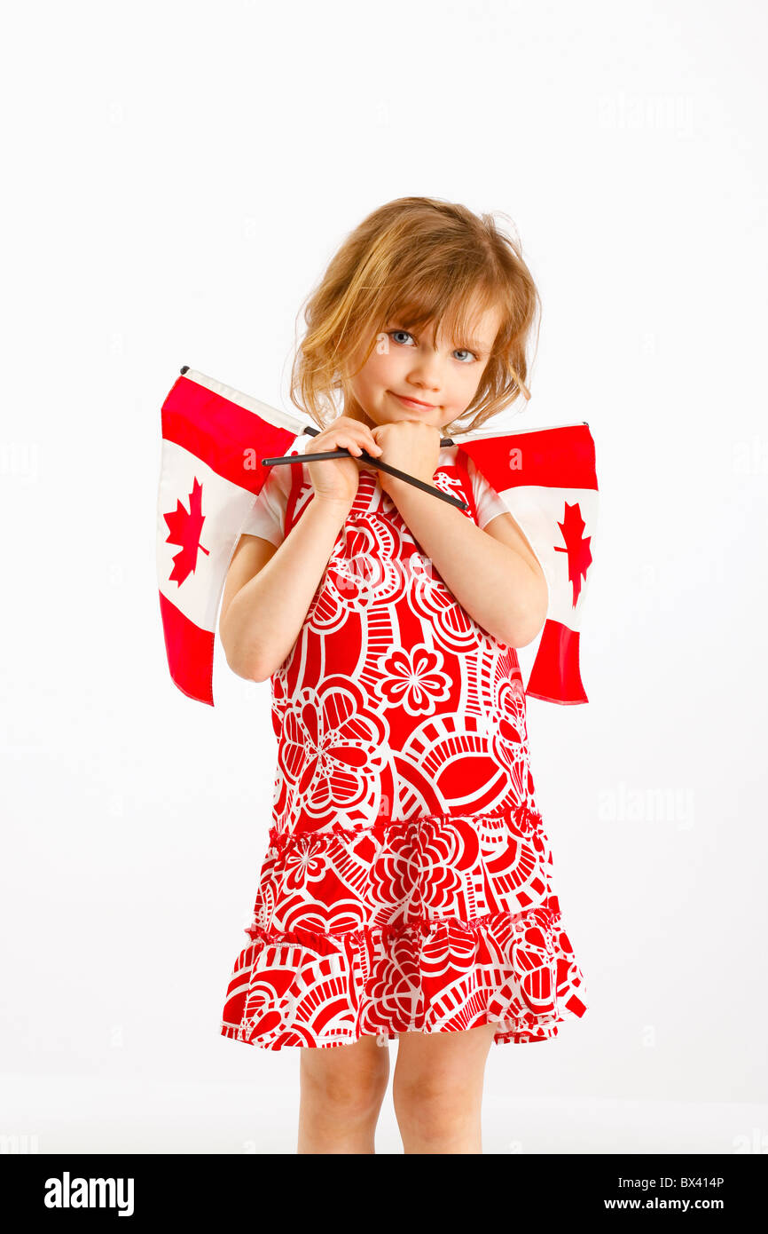 A Girl Holding Two Canada Flags Stock Photo - Alamy