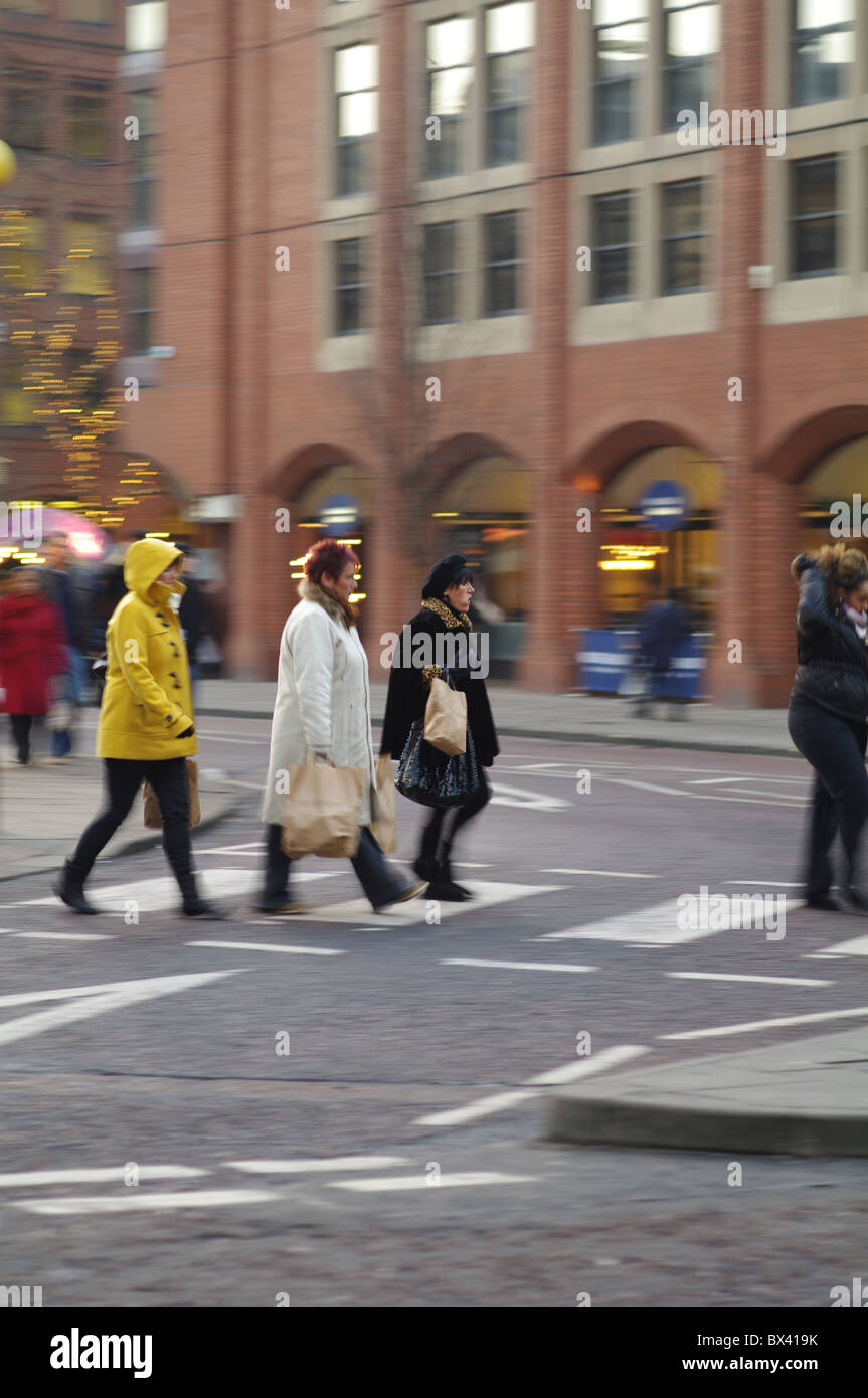 Females crossing road in central Manchester Stock Photo - Alamy