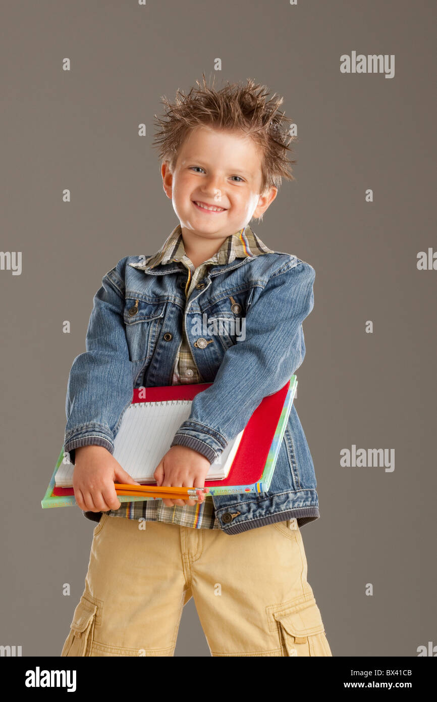 Kid Holding Pencils And Notebooks High Resolution Stock Photography and Images - Alamy