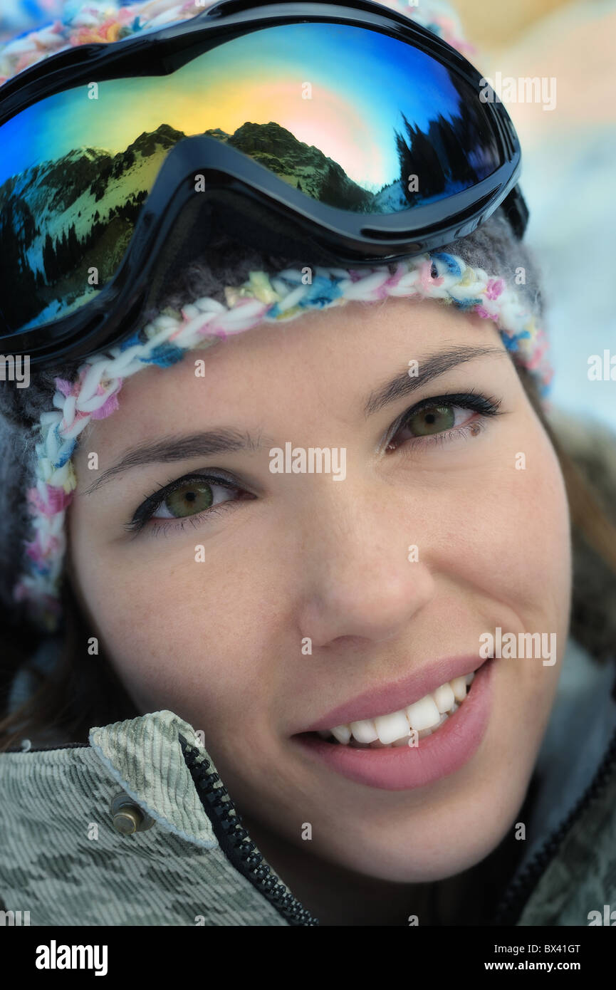Pretty girl with snowboard glasses smiling Stock Photo - Alamy
