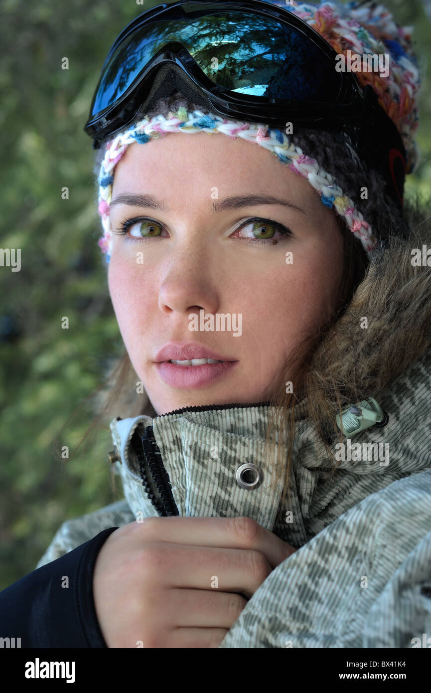 Portrait of pretty girl with snowboard glasses Stock Photo - Alamy
