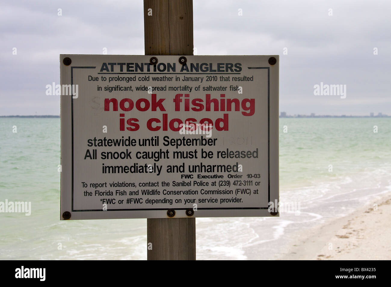 Warning sign on the beach Stock Photo - Alamy