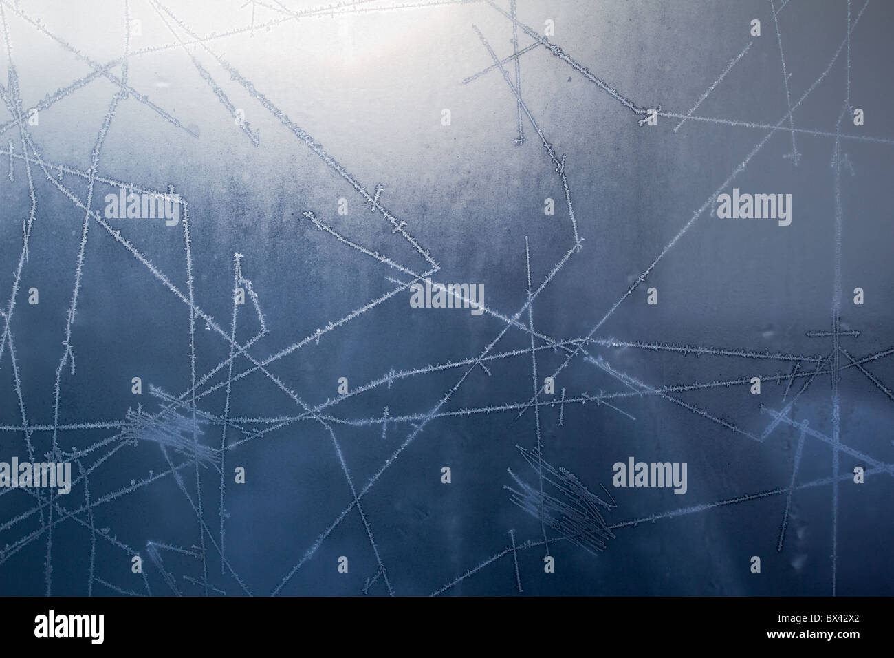 Frosty Window Pane backlit with early morning winter sun texture or ...