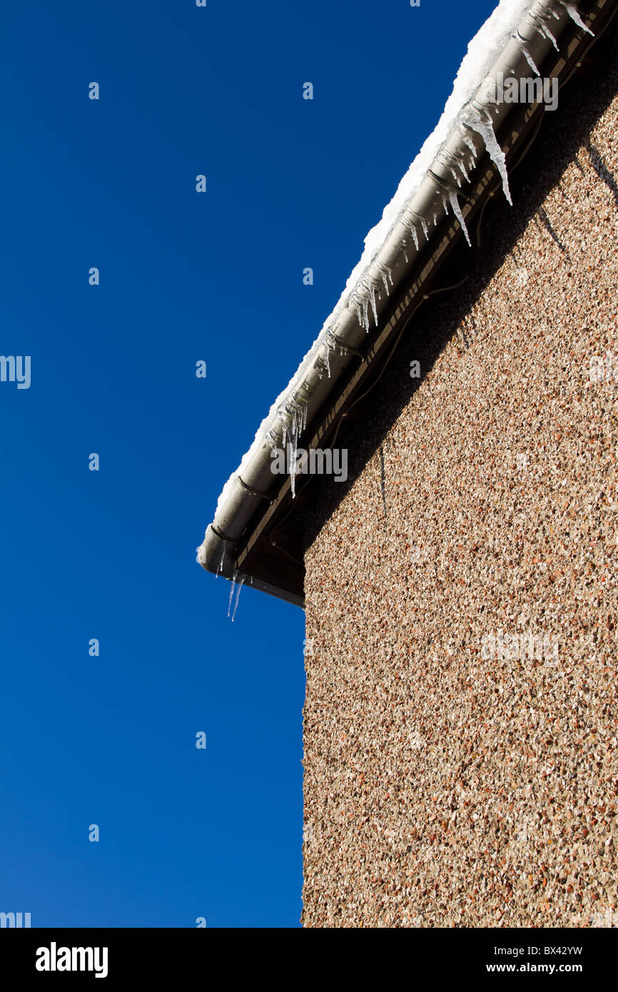 Cold snap home maintenance concept of frozen gutters Stock Photo - Alamy