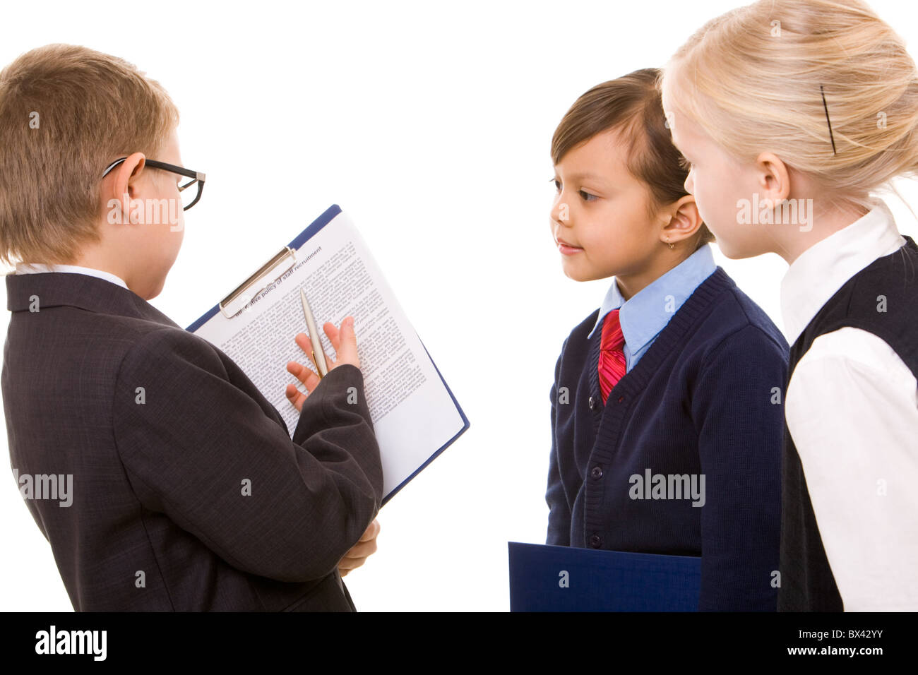 Portrait of three children discussing new plan in boy’s hand Stock ...