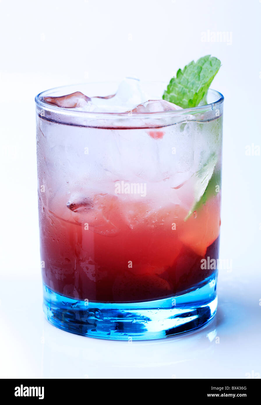 Glass of cocktail drink with ice Stock Photo - Alamy