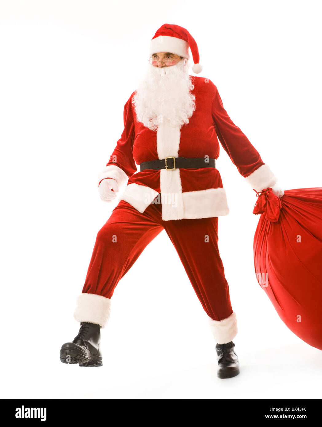 Portrait of Santa Claus carrying heavy sack with presents Stock Photo ...
