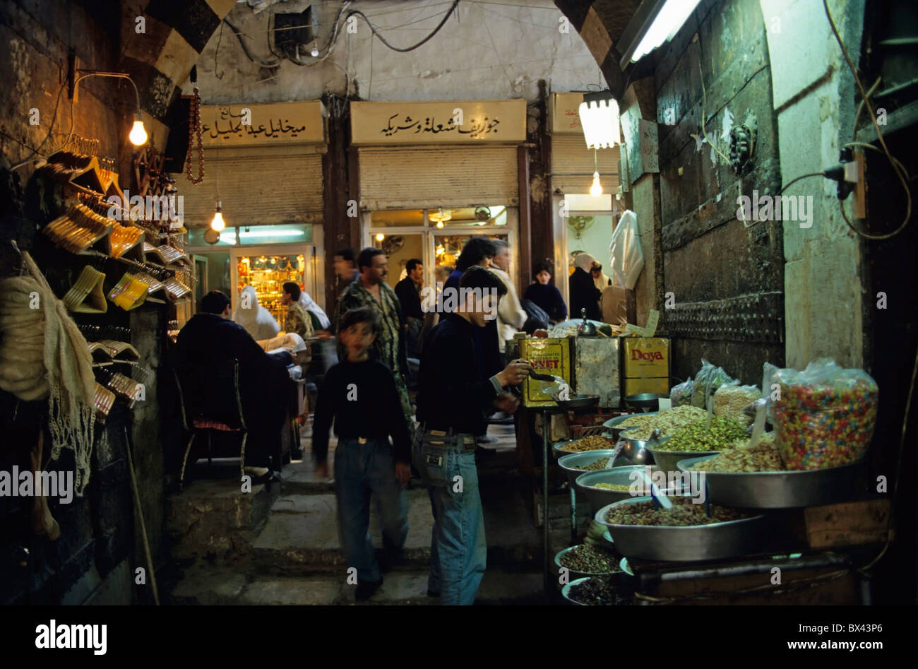 People shopping in a souq at the Al Hamadiyyeh Markets, Damascus, Syria ...