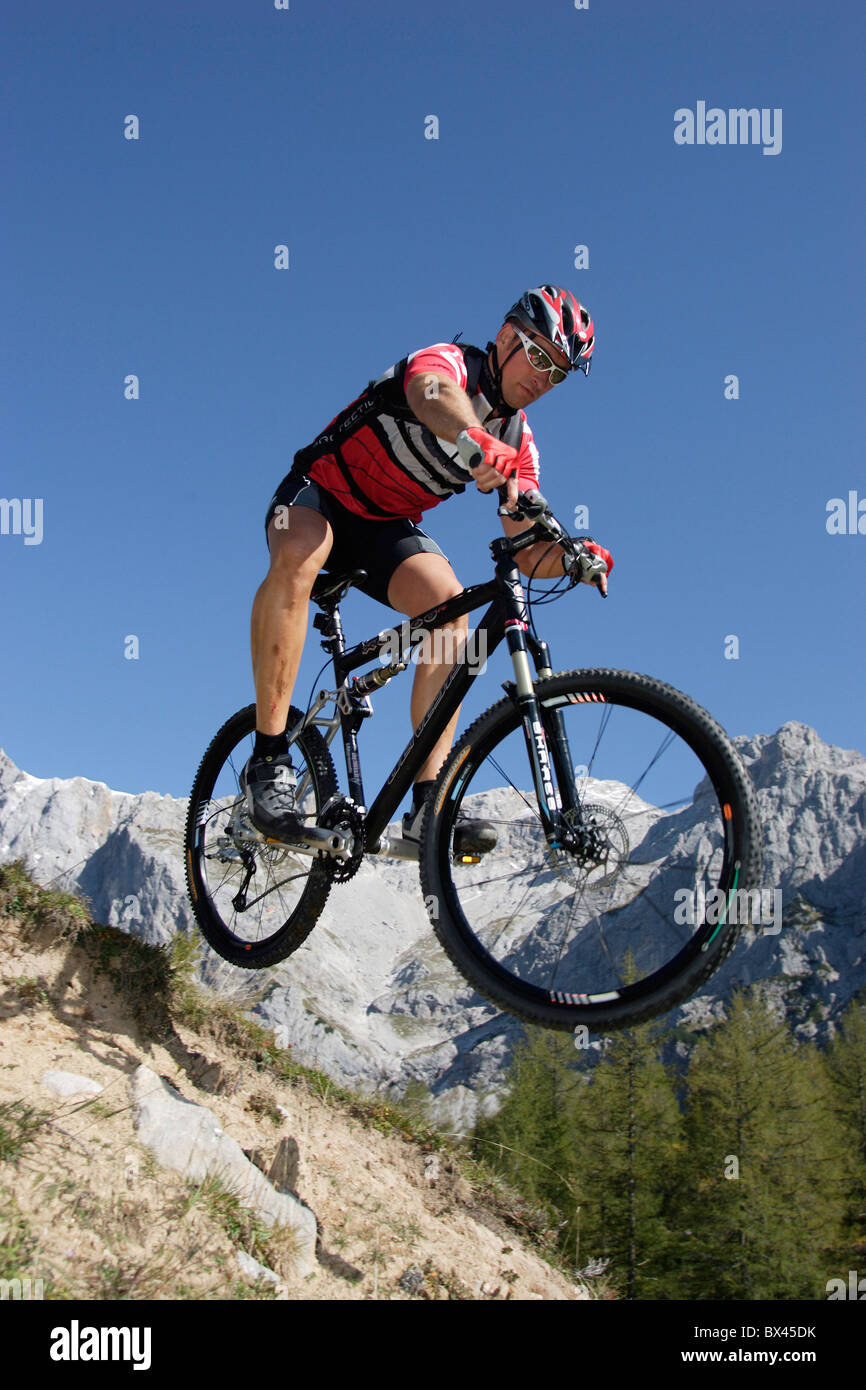 man Downhill jump Biking mountains Alps bicycle biking mountain bike ...