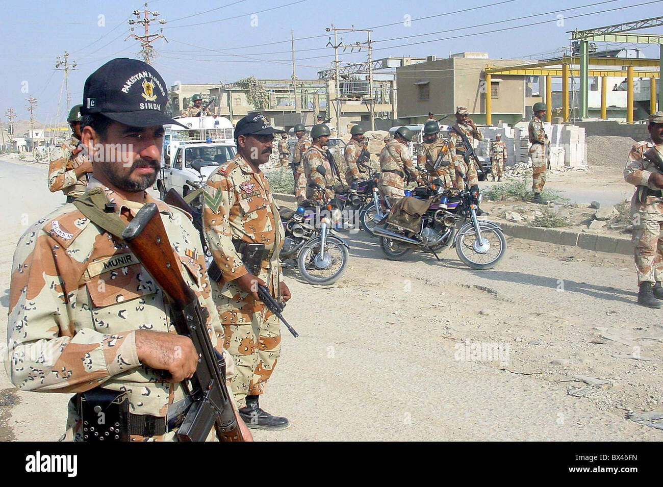 Rangers officials stand alert during search operation at Manghopir area ...