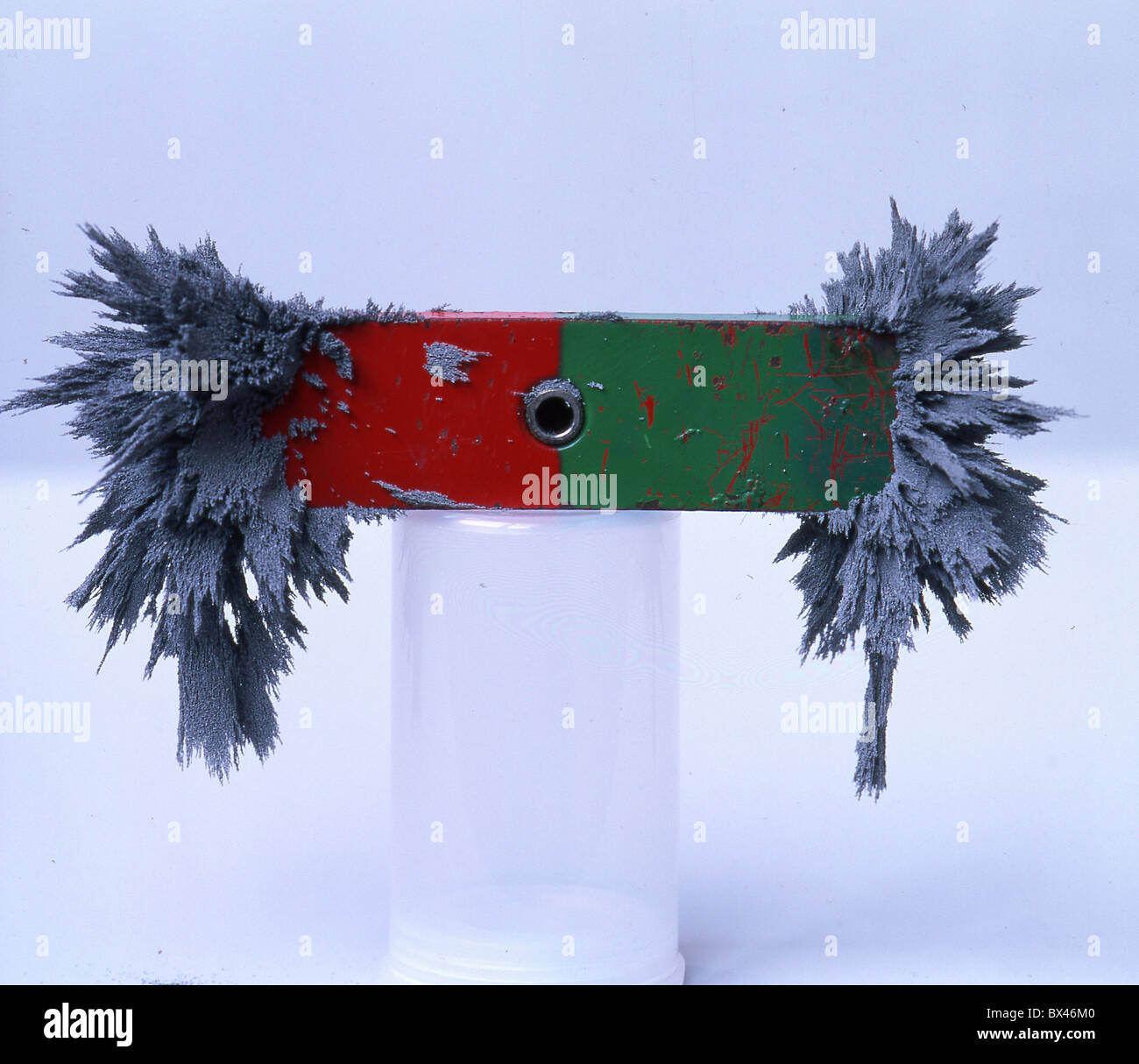 magnet magnetic field iron chips physics magnetism Stock Photo - Alamy