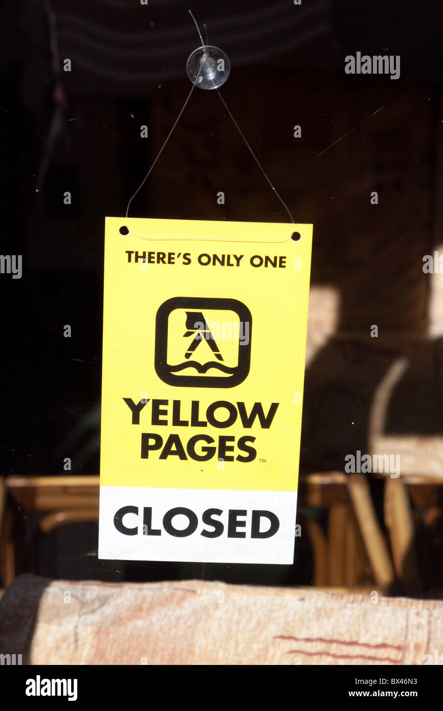 Yellow Pages shop closed sign Stock Photo - Alamy