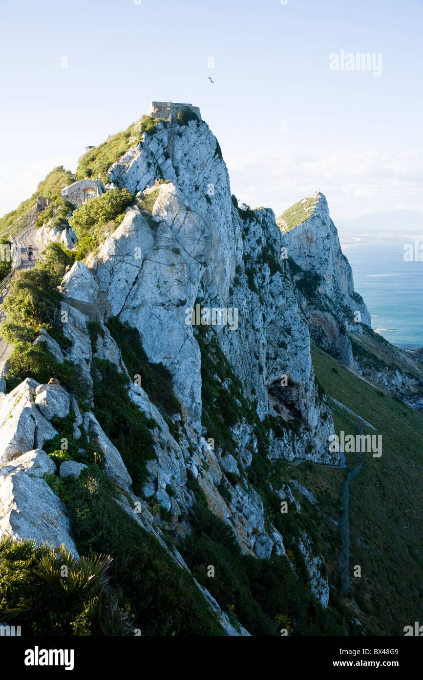 Cliff on the side of the ridge of the Rock of Gibraltar, and peak tops ...