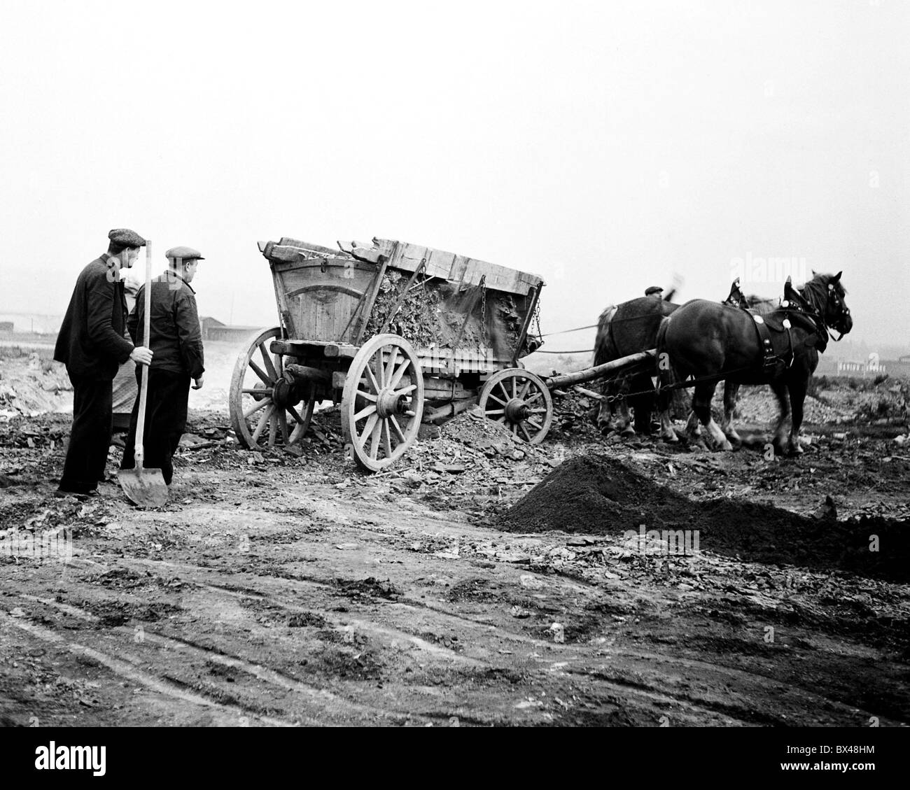 Prague 1938, horse drawn carriage rolls over trash area at Maniny Stock ...