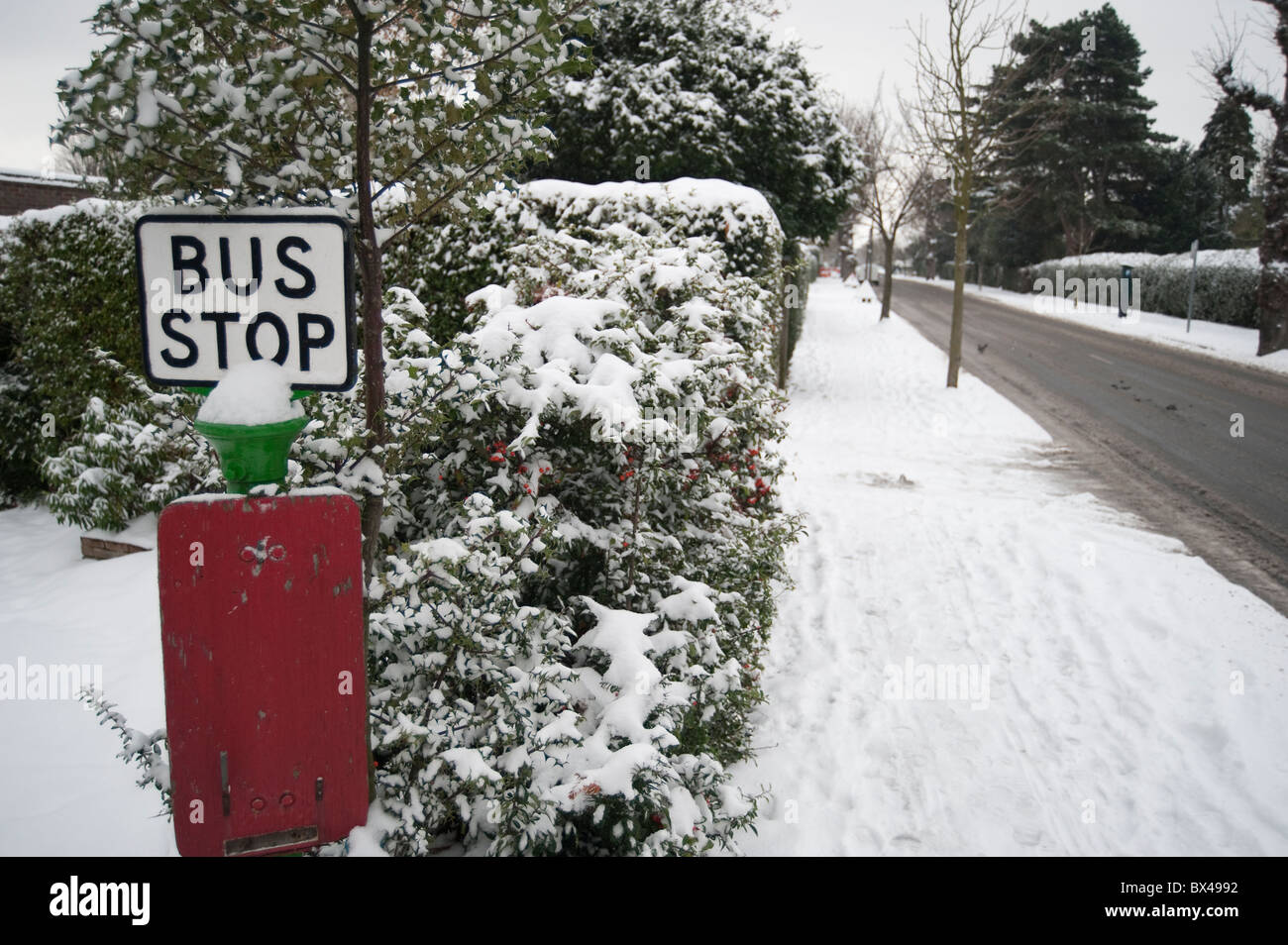 Bus Stop Sign in Snow Stock Photo - Alamy