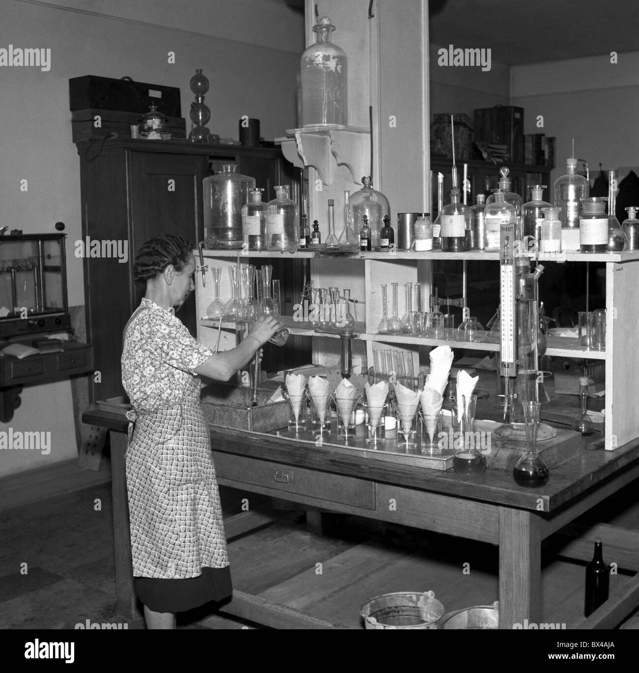 Laborator techincian conducting tests at factory ctk vintage photo hi ...