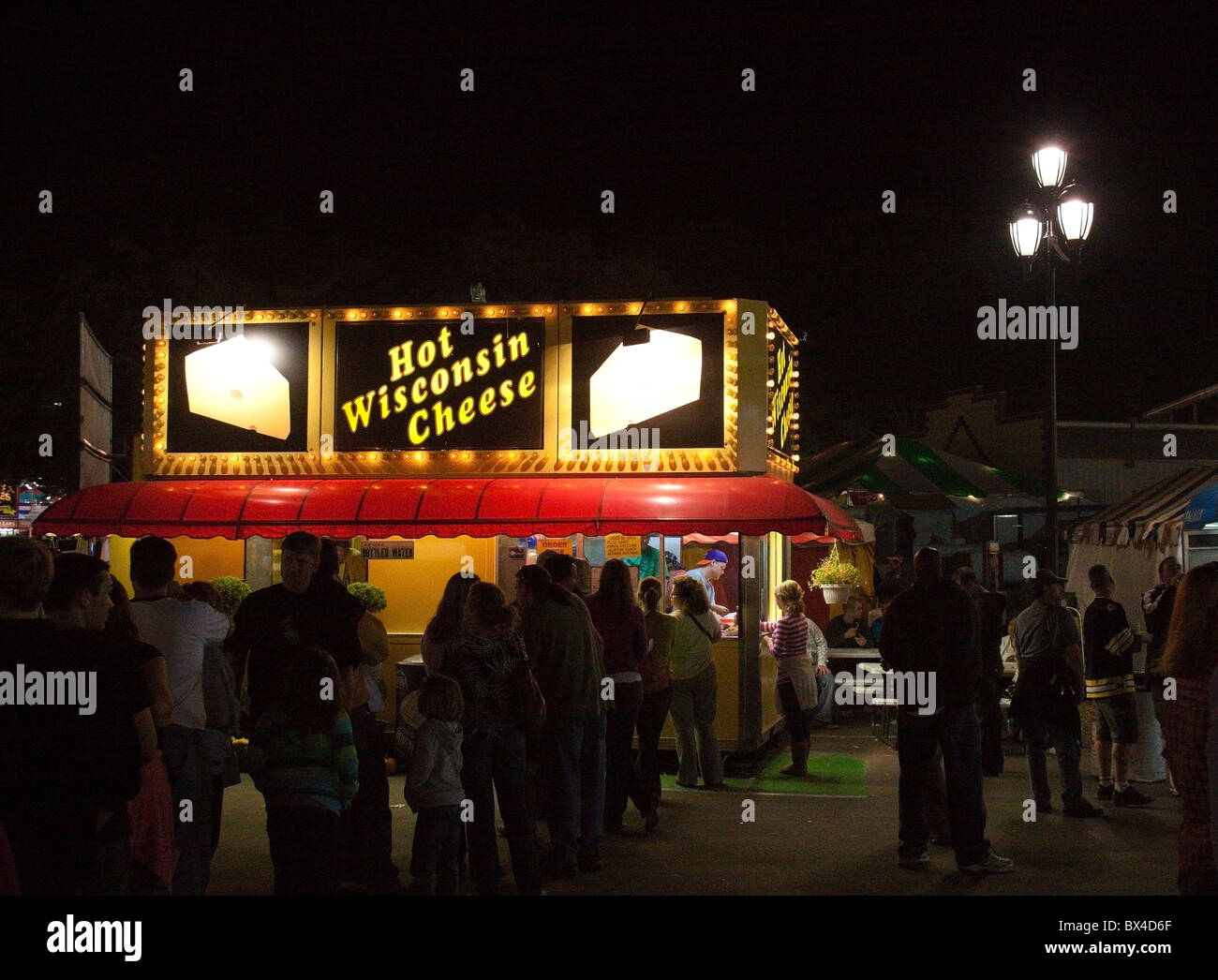 Crowds of people enjoy an evening at the North Carolina State Fair ...